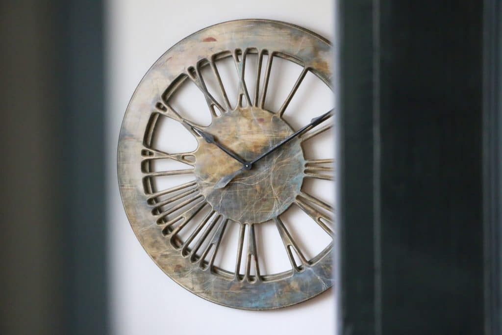 Contemporary Wall Clock with Large Hand Carved Roman Numerals