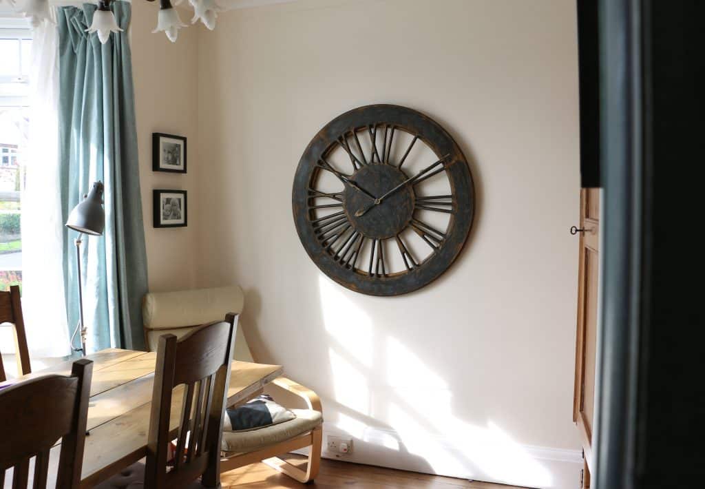 Large Skeleton Wall Clock: Eye-Catching Dark Graphite Design